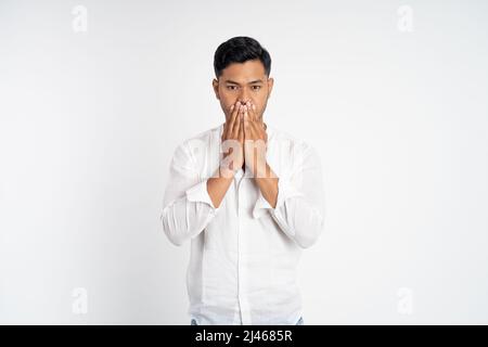 man with uncomfortable expression with two hands covering eyes Stock ...