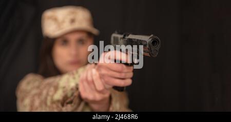 female hand holding gun aiming in subjective point of view POV isolated ...