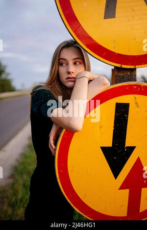 Portrait of woman with traffic signs Stock Photo - Alamy