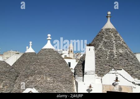 The conic roofs, with pinnacle, of 500-year-old traditional trulli rock ...