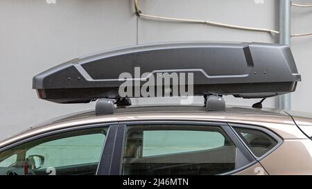 Big Black Aerodynamic Shape Roof Top Cargo Box at White Car Stock Photo ...
