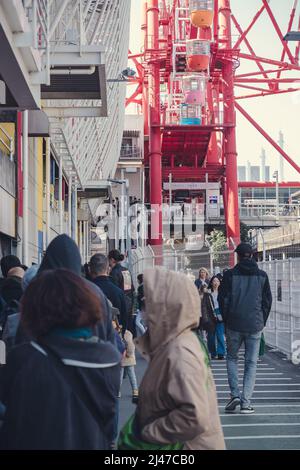 People waiting in line at the amusement park to get on the rides Stock ...