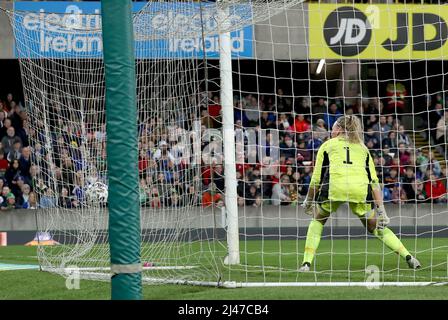 A shot from England's Lauren Hemp, right, hits the crossbar during the ...