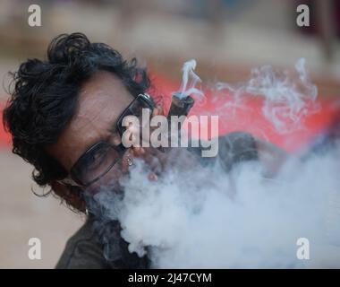 A Hindu Holy man blows a buffalo horn during a three day long ...