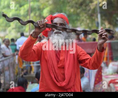 Holy people dancing to a different folk music at the temple during ...