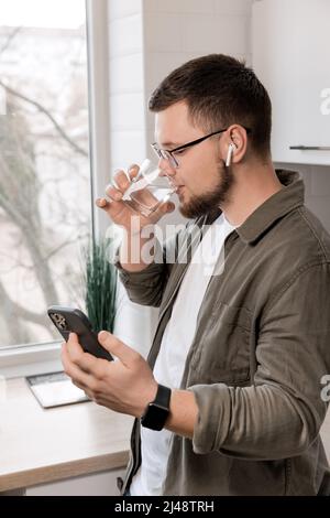 Young businesswoman at home office drinks coffee slowly reads plan in ...