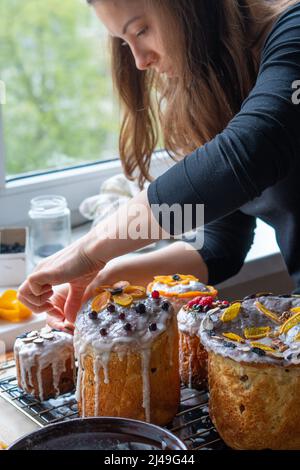 Traditional Easter cake paska. Woman hands holding easter egg. Table ...