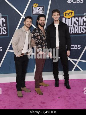 Colton Pack, Garrett Nichols, and Zach Beeken of Restless Road attend ...