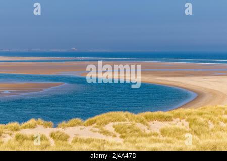 Budle Water at Budle Bay with Lindisfarne Castle in the background ...
