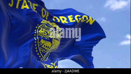 The US state flag of Oregon waving in the wind Stock Photo - Alamy