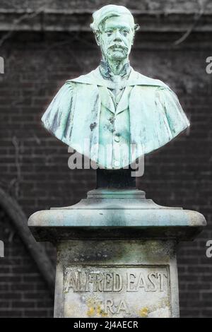 Bust of the artist Alfred East in the garden of the gallery named after ...