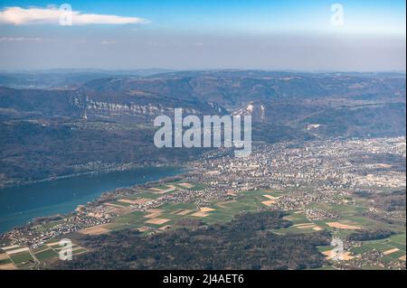 An aerial view of the Lake Biel Bienne during the flood on a cloudy day ...