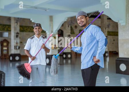 muslim young male cleaning the mosque before praying Stock Photo - Alamy