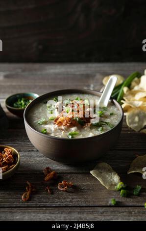 Steamy bowl of Chicken Jook in a rustic kitchen Stock Photo - Alamy