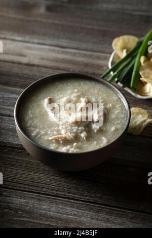 Steamy bowl of Chicken Jook in a rustic kitchen Stock Photo - Alamy