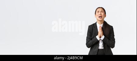 Overworked and distressed asian businesswoman begging for help ...