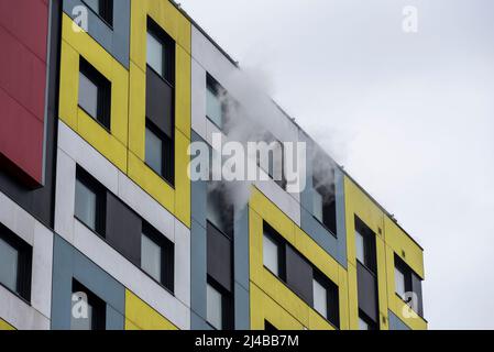 Controlled smoke from the top floors of cladding covered university ...