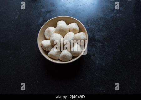 Indian dessert item rasgulla or rosogolla in a bowl. Close up ...