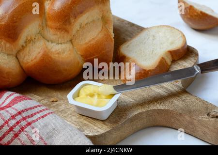 Butter in portion packs and butter plait Stock Photo - Alamy