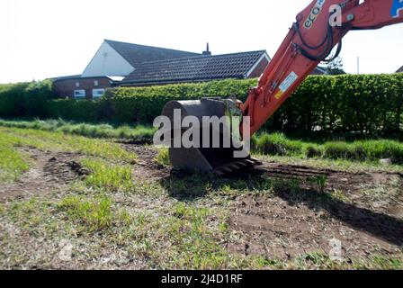 Bucket of Orange Zaxis 210 lc excavator digger being used for ...