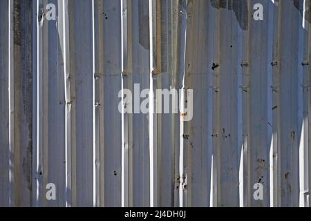 Corrugated metal plates surrounding wasteland Stock Photo - Alamy