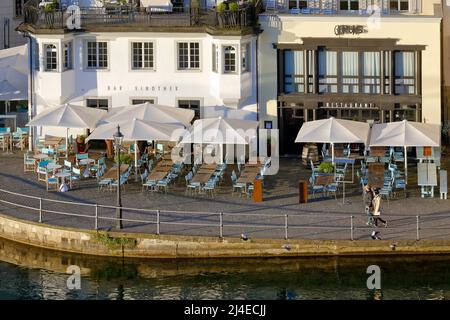 Outdoor Tables and Chairs Near a Swiss Hotel with Alpine View in Summer ...