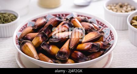 pinhão seed, typical Brazilian seed, served cooked. Food rich in ...