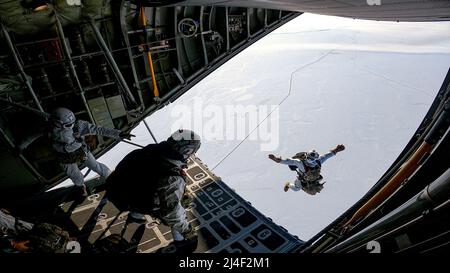 Naval Special Warfare members perform a high-altitude low-opening jump ...