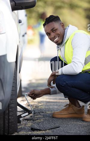 Man change the wheel manually on a 4x4 off road truck Stock Photo - Alamy