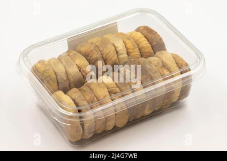 Packed dried figs on a white background. Packaged dried figs for sale ...