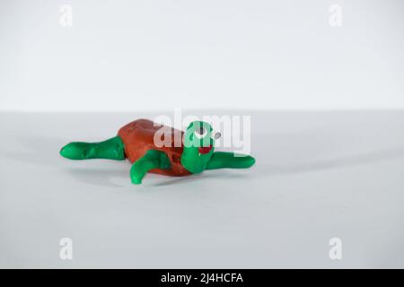 Plasticine turtle. Platinum toys on a white background Stock Photo - Alamy