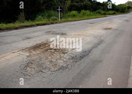 highway roof with defective and spoiled asphalt, dangerous for traffic ...