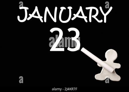 23rd day of January. A small white plasticine man writing the date 23 ...