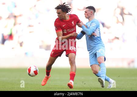 Phil Foden of Manchester City competes for the ball with Morgan Gibbs ...