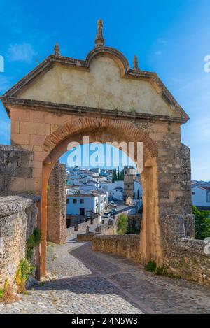 Stone arch looming over fortification of Spanish town Ronda Stock Photo ...
