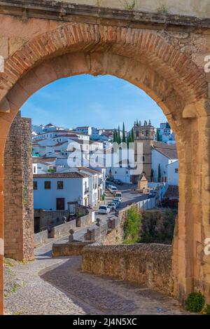 Stone arch looming over fortification of Spanish town Ronda Stock Photo ...