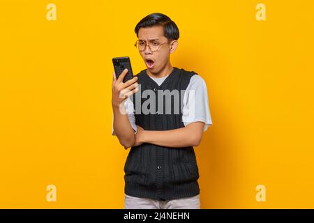 Young person shouting in loudspeaker Stock Photo - Alamy