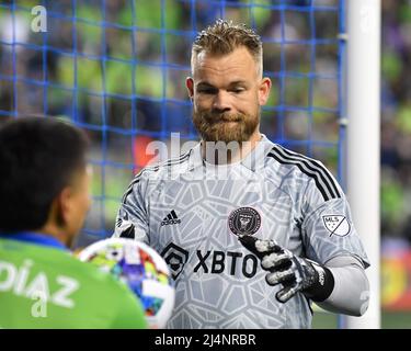 Inter Miami goalkeeper Nick Marsman, center, dives to deflect a shot ...