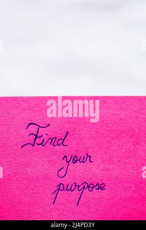 Find your purpose handwriting text close up isolated on pink paper with ...