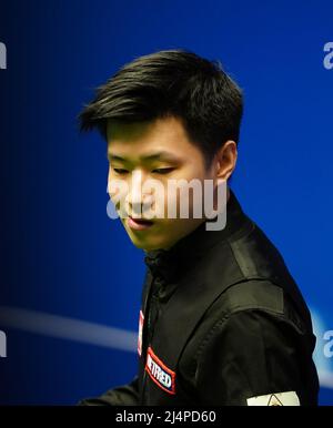 Zhao Xintong in action against Gary Wilson (not in picture)on day two ...