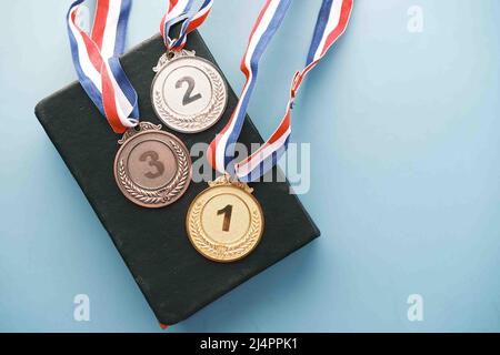 first, second and third Place Throphy on blue Stock Photo - Alamy