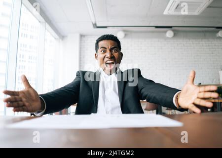 Annoyed furious african businessman shout on arabian worker angry man ...