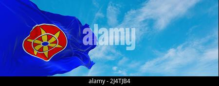 official flag of Kven people , Norway at cloudy sky background on ...