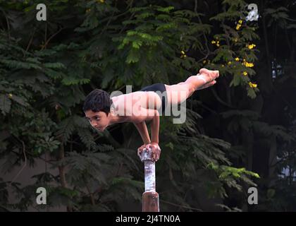 A boy performs during a Mallakhamb championship in Mumbai. Mallakhamb ...