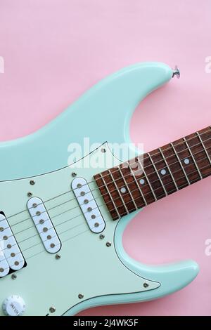 Detail of Mint Green Electric Guitar on a Pink background Stock Photo ...