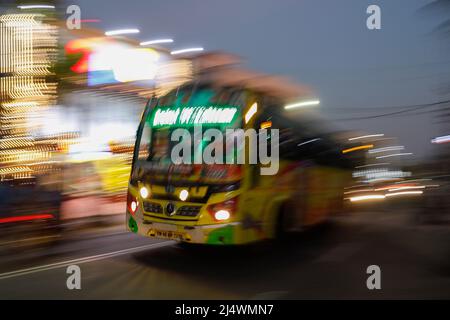 Modern long distance bus travelling in the street,Trichy, Tamil Nadu ...