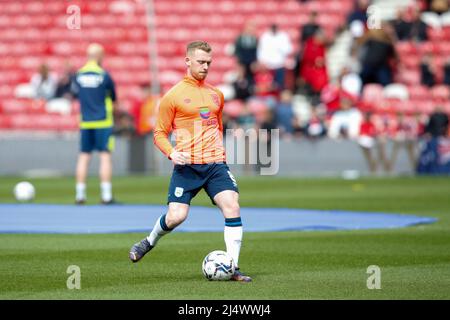 Lewis O'Brien #8 of Huddersfield Town warms up before the game Stock ...