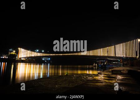 A beautiful shot of an illuminated cityscape reflecting in the water ...