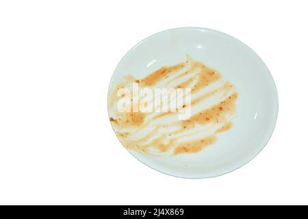 food stain left after eat on dish in white background Stock Photo - Alamy