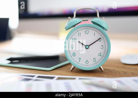 Alarm clock for ten o'clock at workplace in office Stock Photo - Alamy